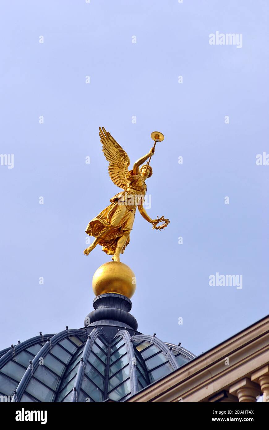 Sculpture of an angel of gold on the dome of the building academy in ...