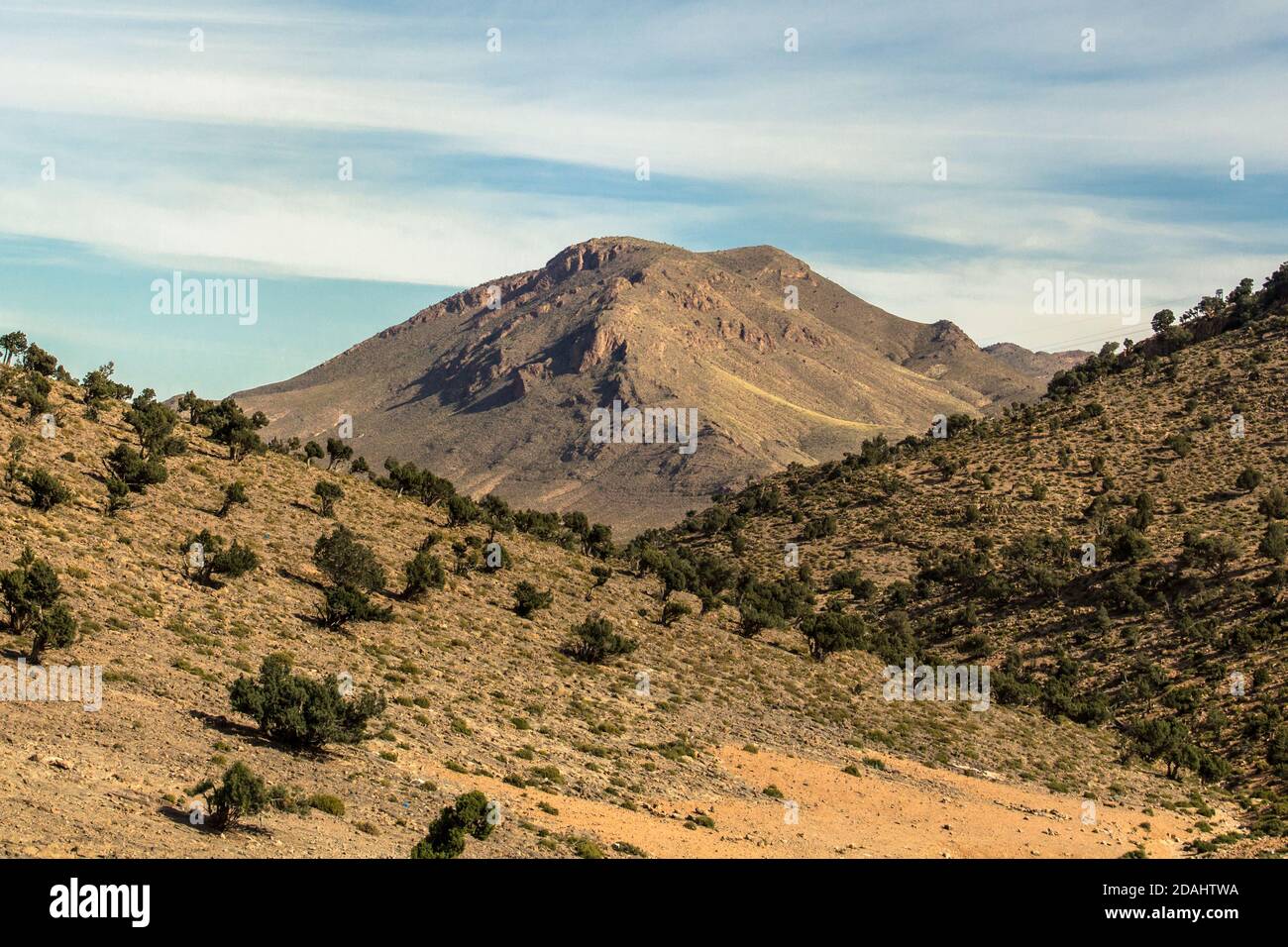 Scenic view of dry atlas mountains against a cloudy sky, Ifrane ...