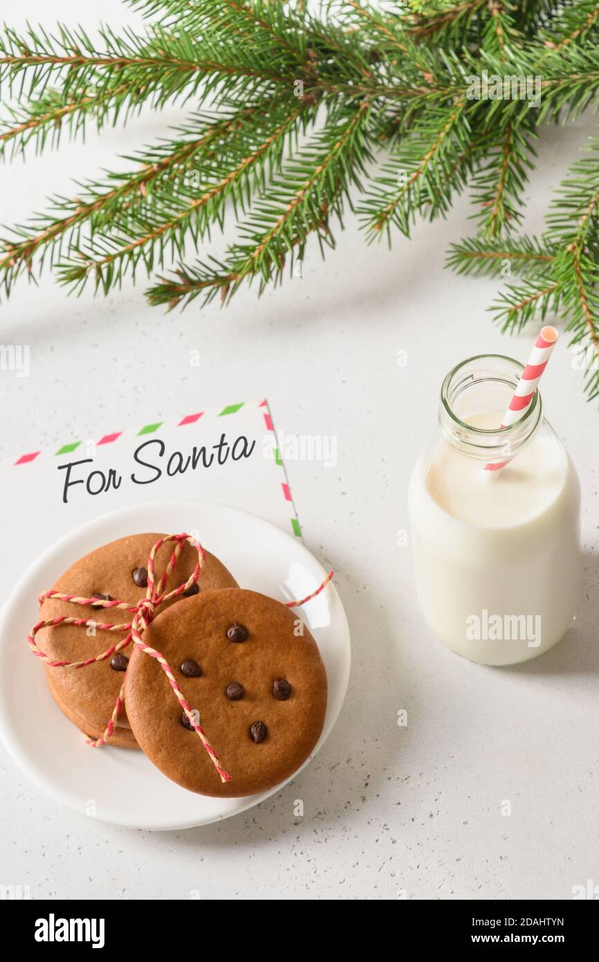 Milk and Letter for Santa, homemade cookies on white. Close up ...