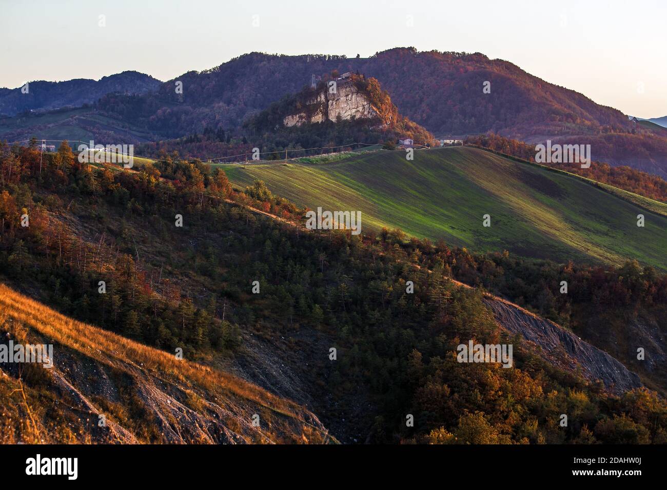 Scenic view of italian countryside village against autumn foliage and ...