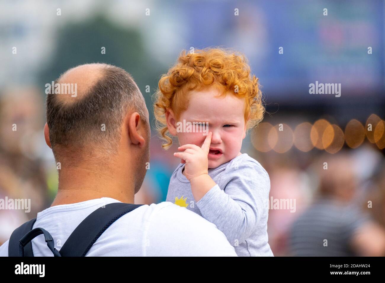Middle aged father with crying baby Stock Photo - Alamy