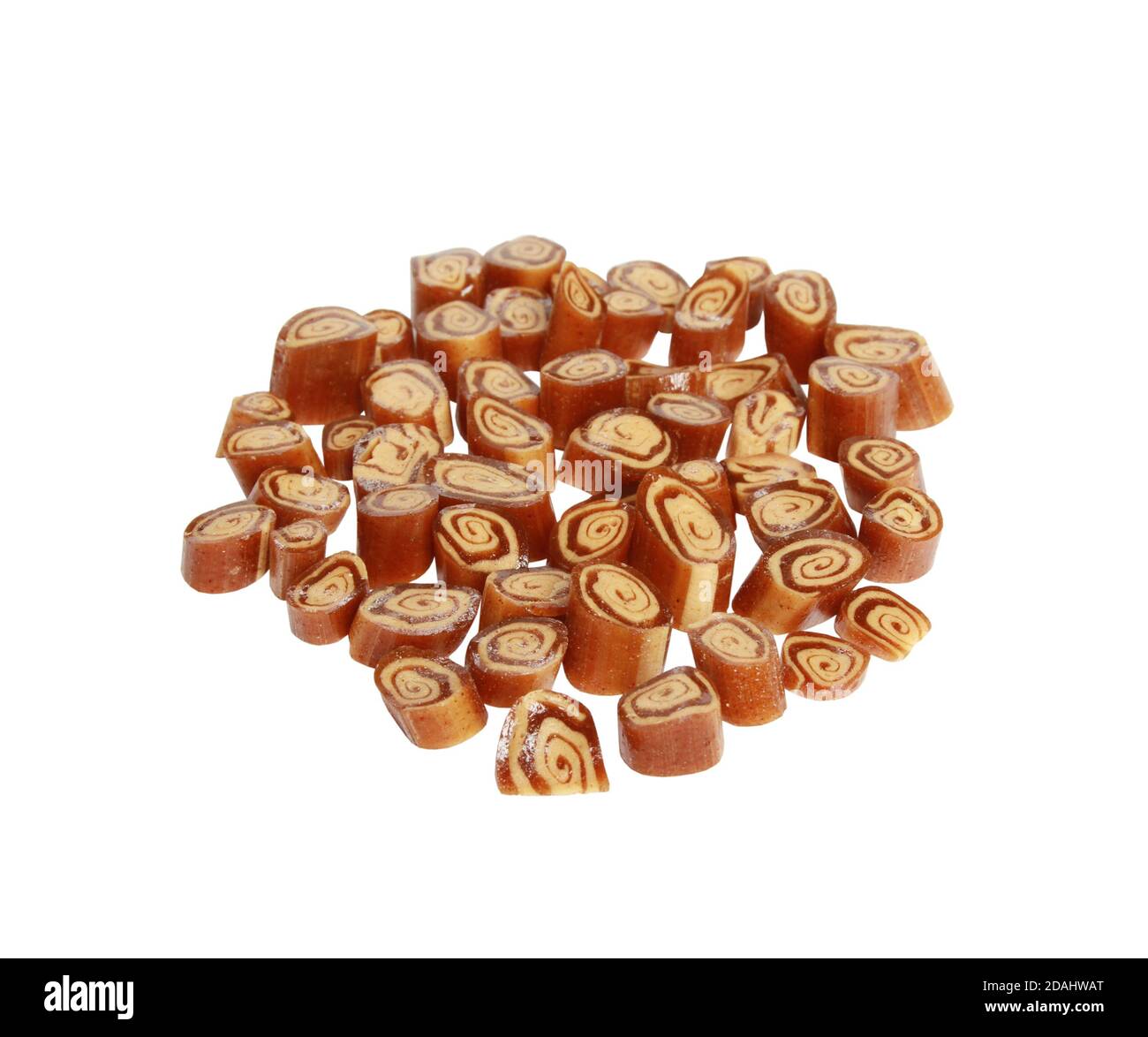Pile of brown candies isolated on white background Stock Photo - Alamy