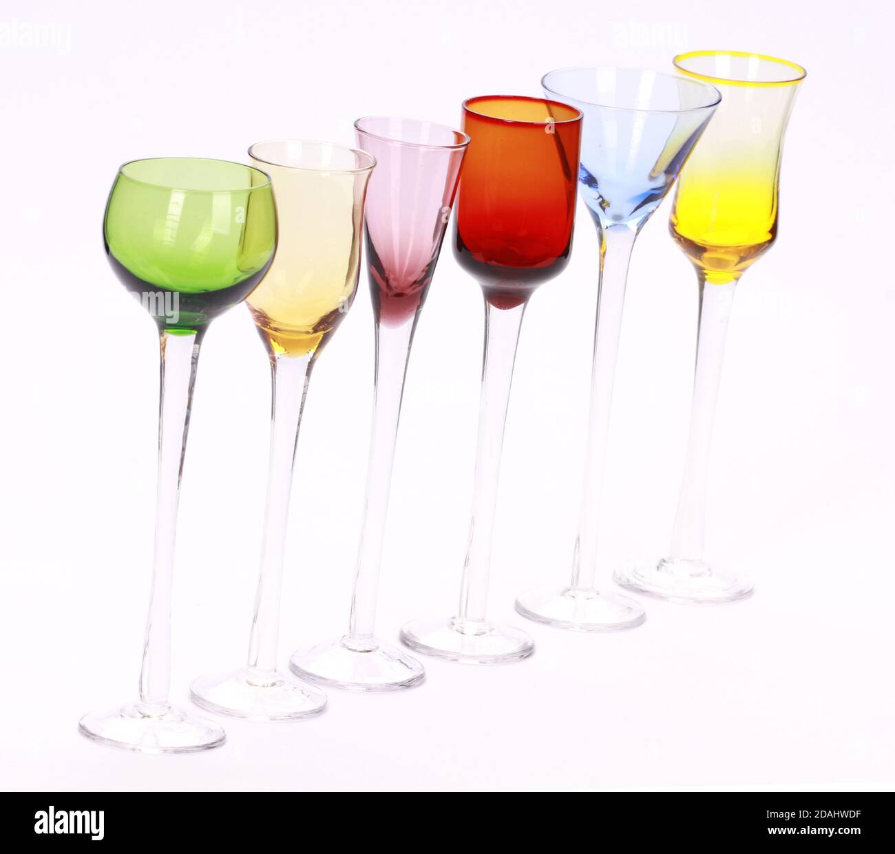 Collection of colorful glassware on white background Stock Photo - Alamy