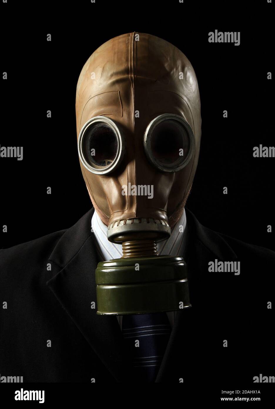 Scary man with no eyes in full protective clothing wearing a gas mask ...