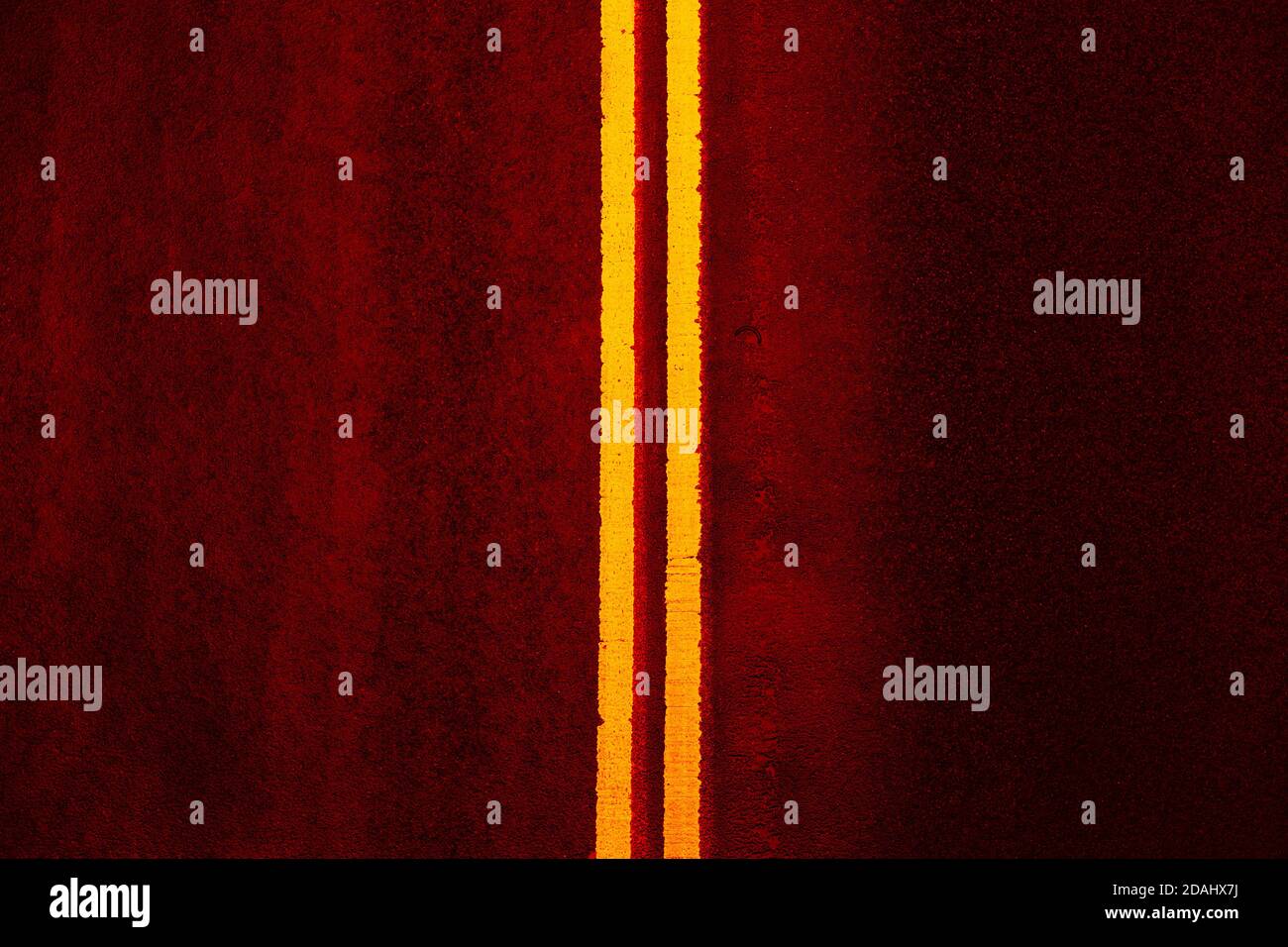 Yellow double solid line. Road markings on asphalt on the street of ...