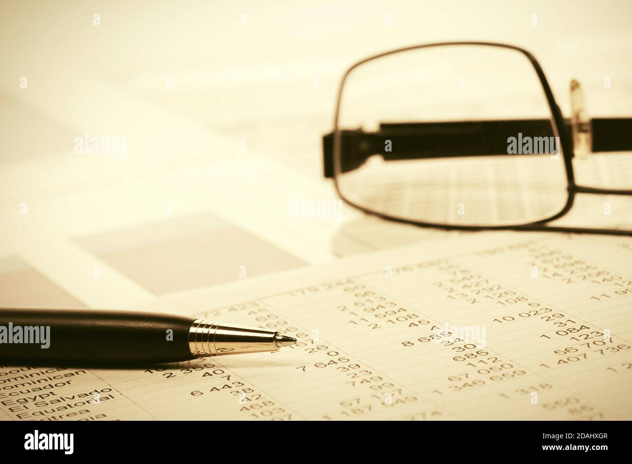 Financial accounting Pen and eyeglasses on balance sheets Stock Photo ...