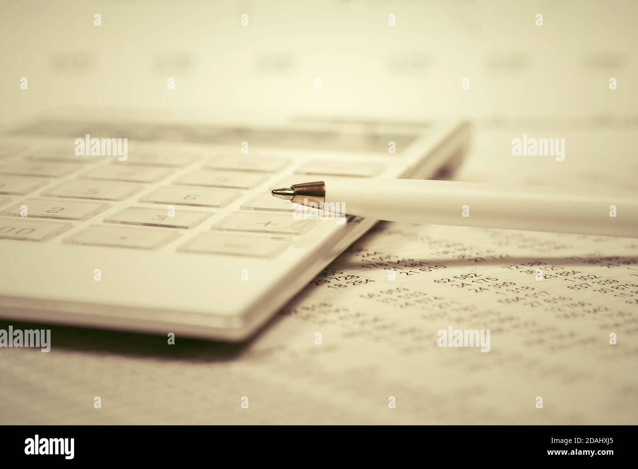 Financial accounting Pen and calculator on balance sheets Stock Photo ...