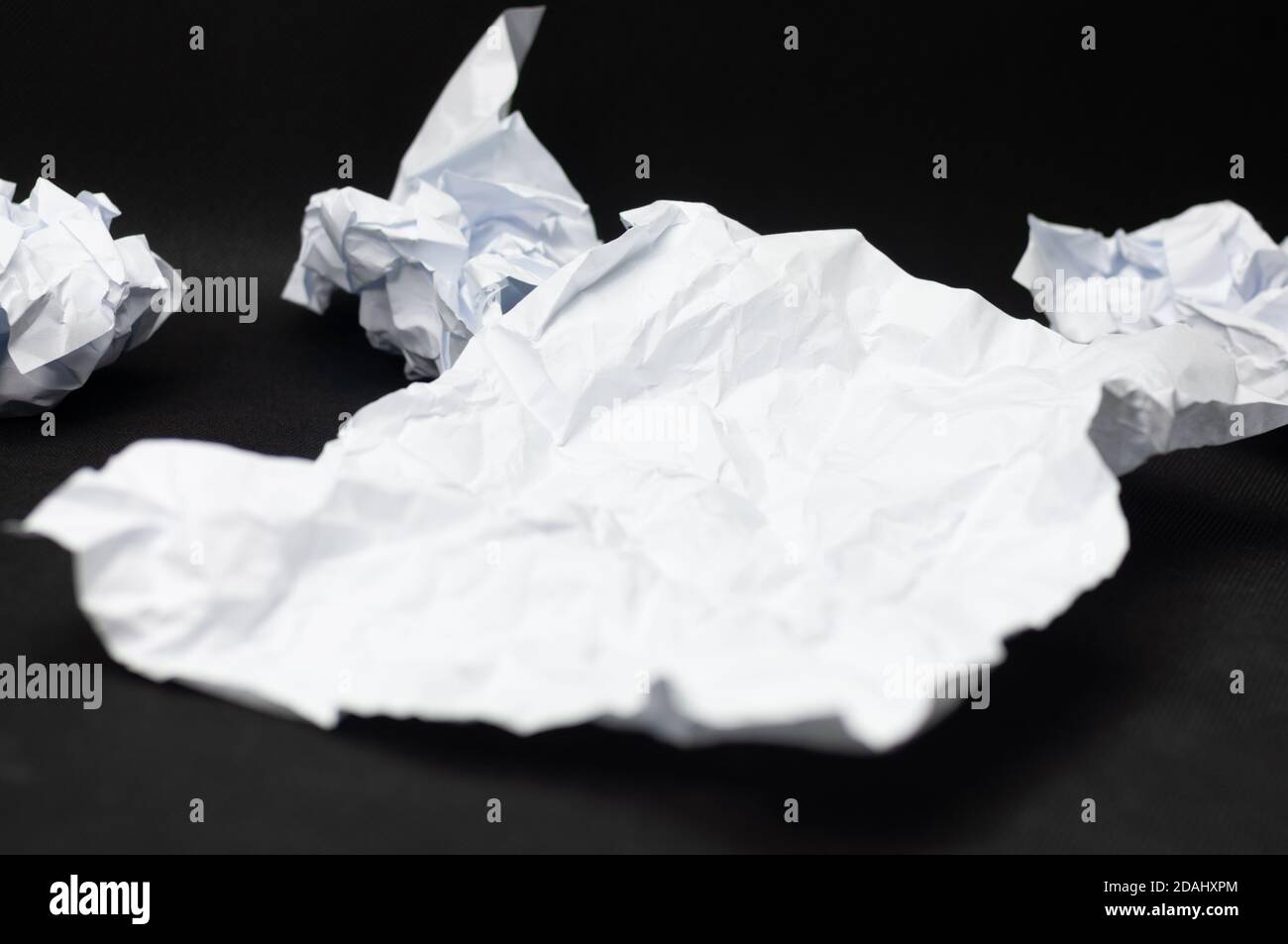 A few crumpled pieces of white paper Stock Photo - Alamy
