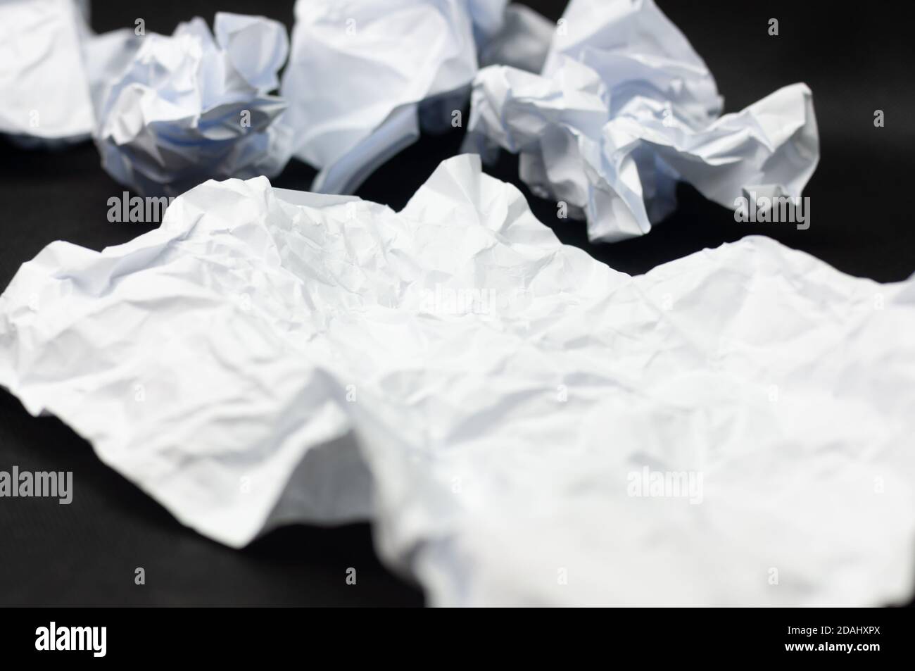 A few crumpled pieces of white paper Stock Photo - Alamy