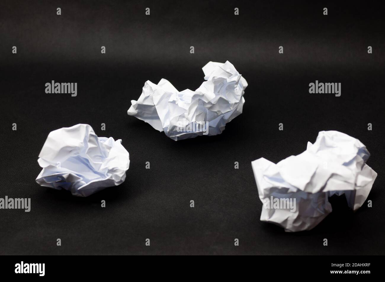 Three crumpled pieces of white paper Stock Photo - Alamy