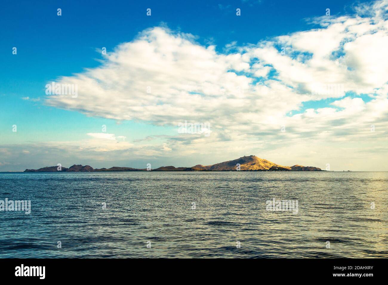 Scenic view of island in Komodo National park against clear water and ...
