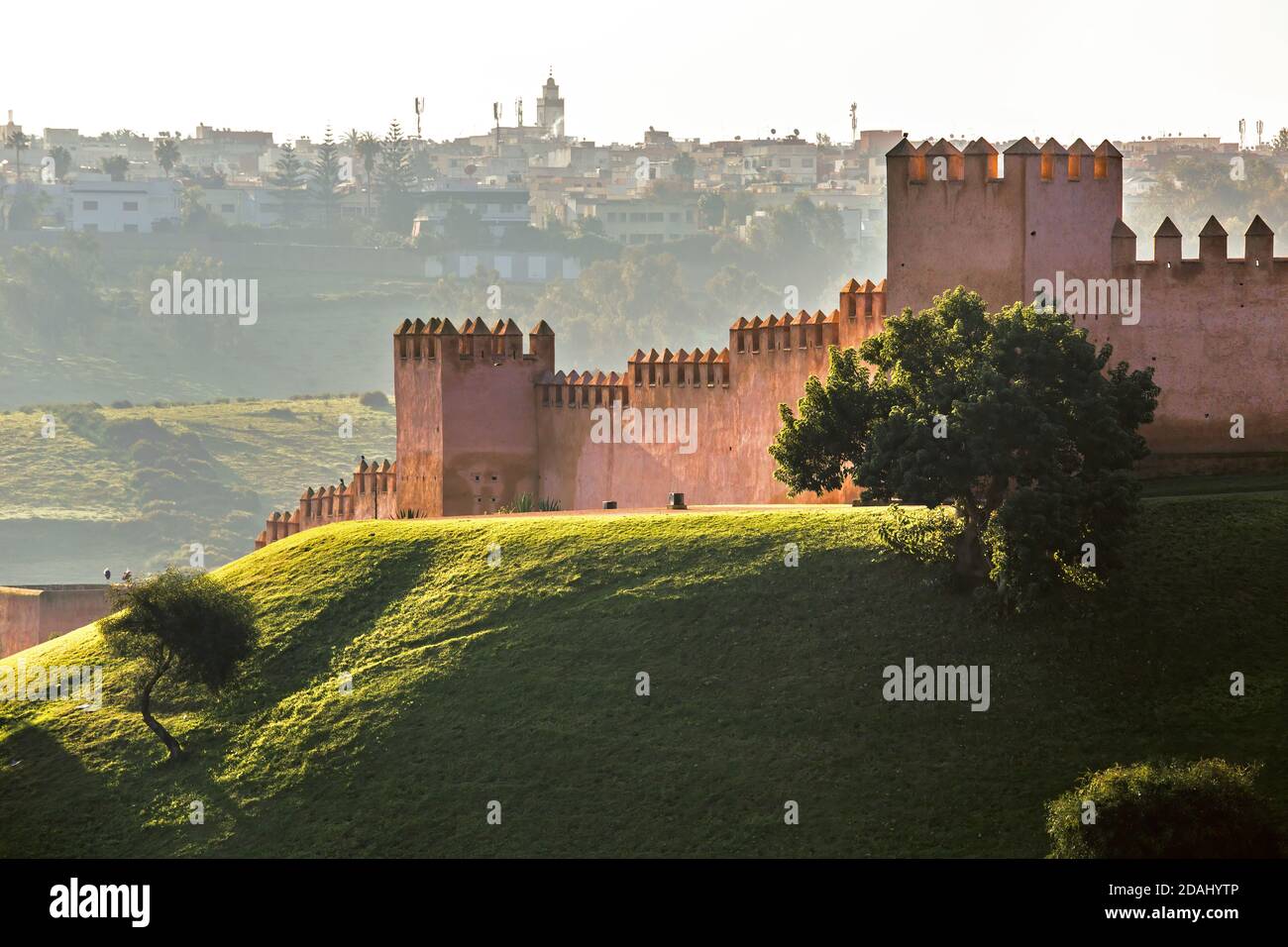 Scenic view of Chellah Necropolis fortress against a green hill and the ...