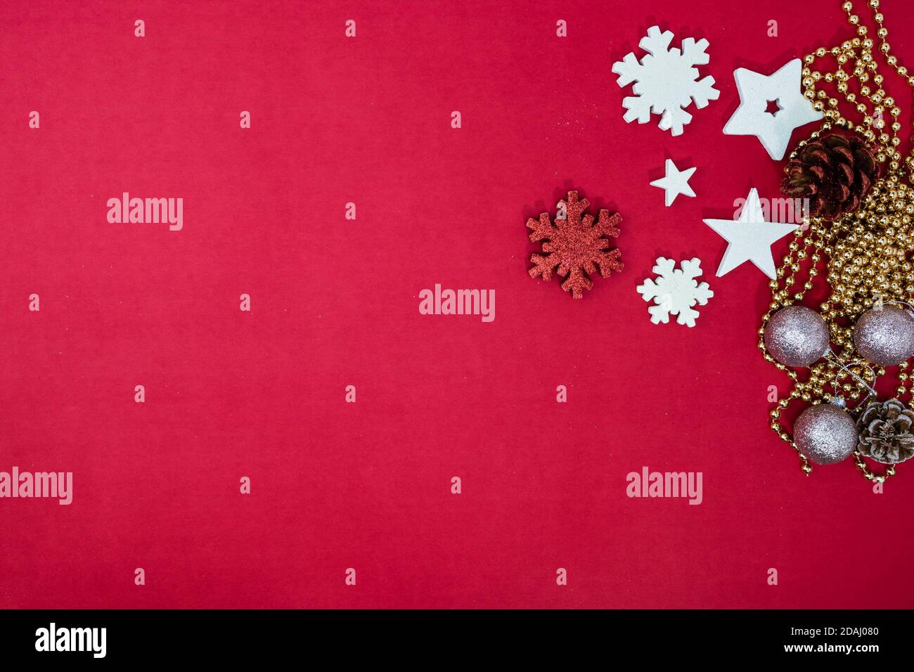 Decorated red Christmas background with christmassy ornaments and ...