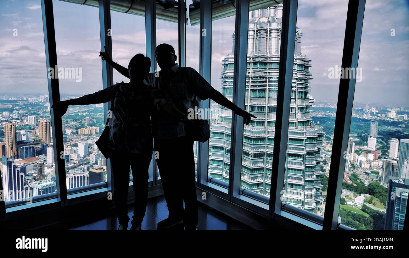 Couple at Petronas Twin Towers Observation Deck to view Kuala Lumpur ...