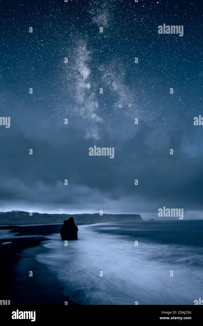 Ocean and coastline at night against starry sky Stock Photo - Alamy