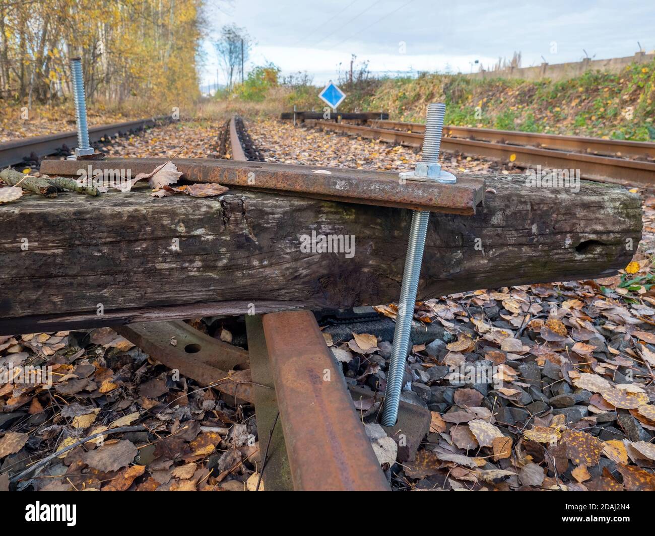 The sleeper screwed acrossing railway. Railroad with vanishing point ...