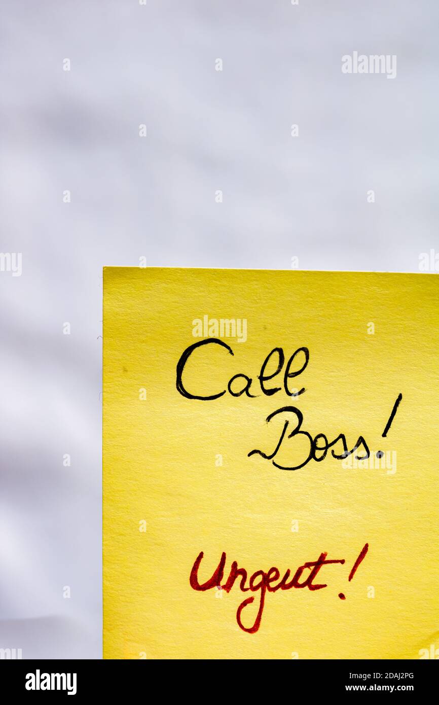 Call boss handwriting text close up isolated on yellow paper with copy ...
