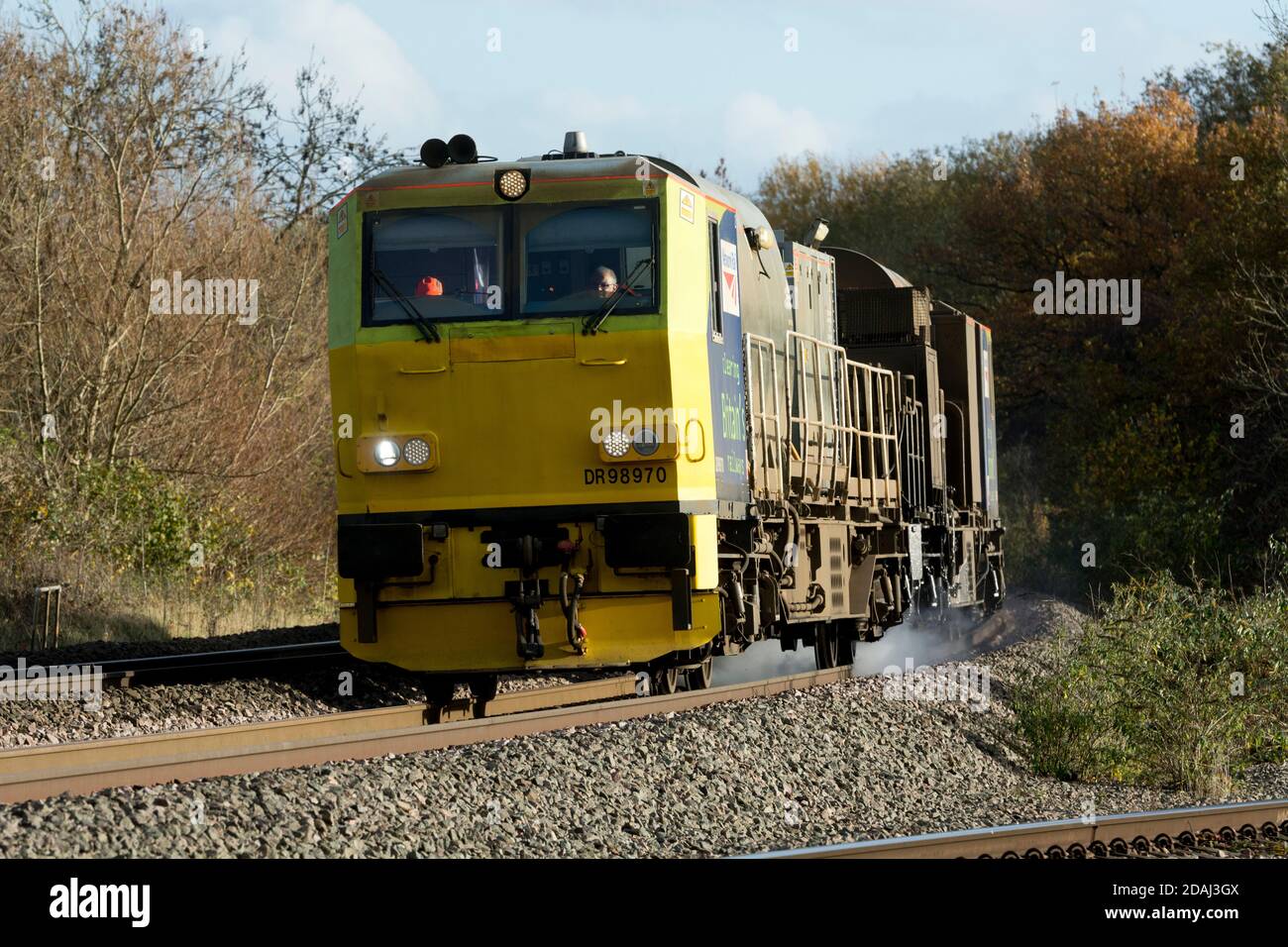 A Network Rail MPV (Multi-purpose vehicle) cleaning rails of fallen ...