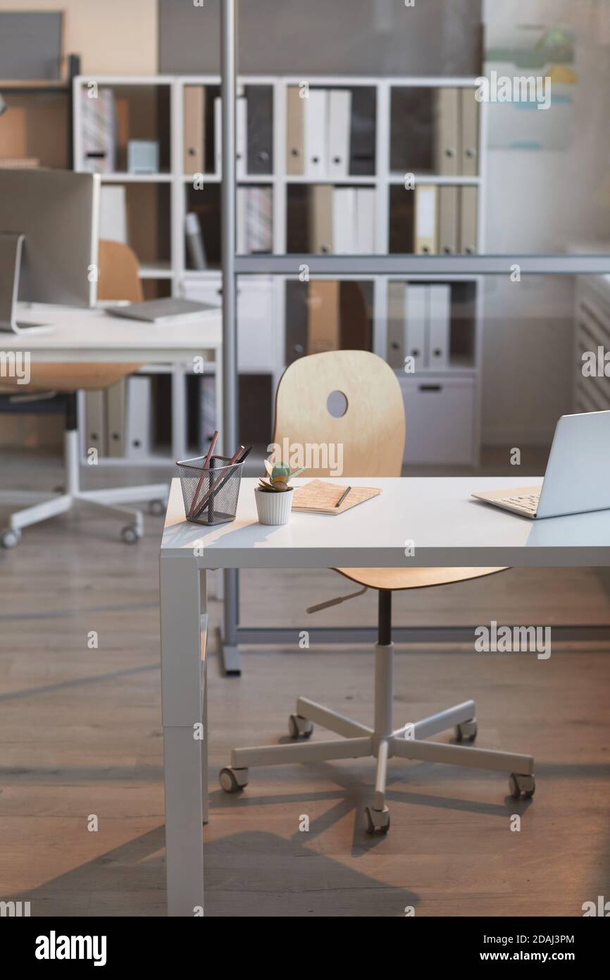 Image of empty workplace with laptop at empty office after working day ...