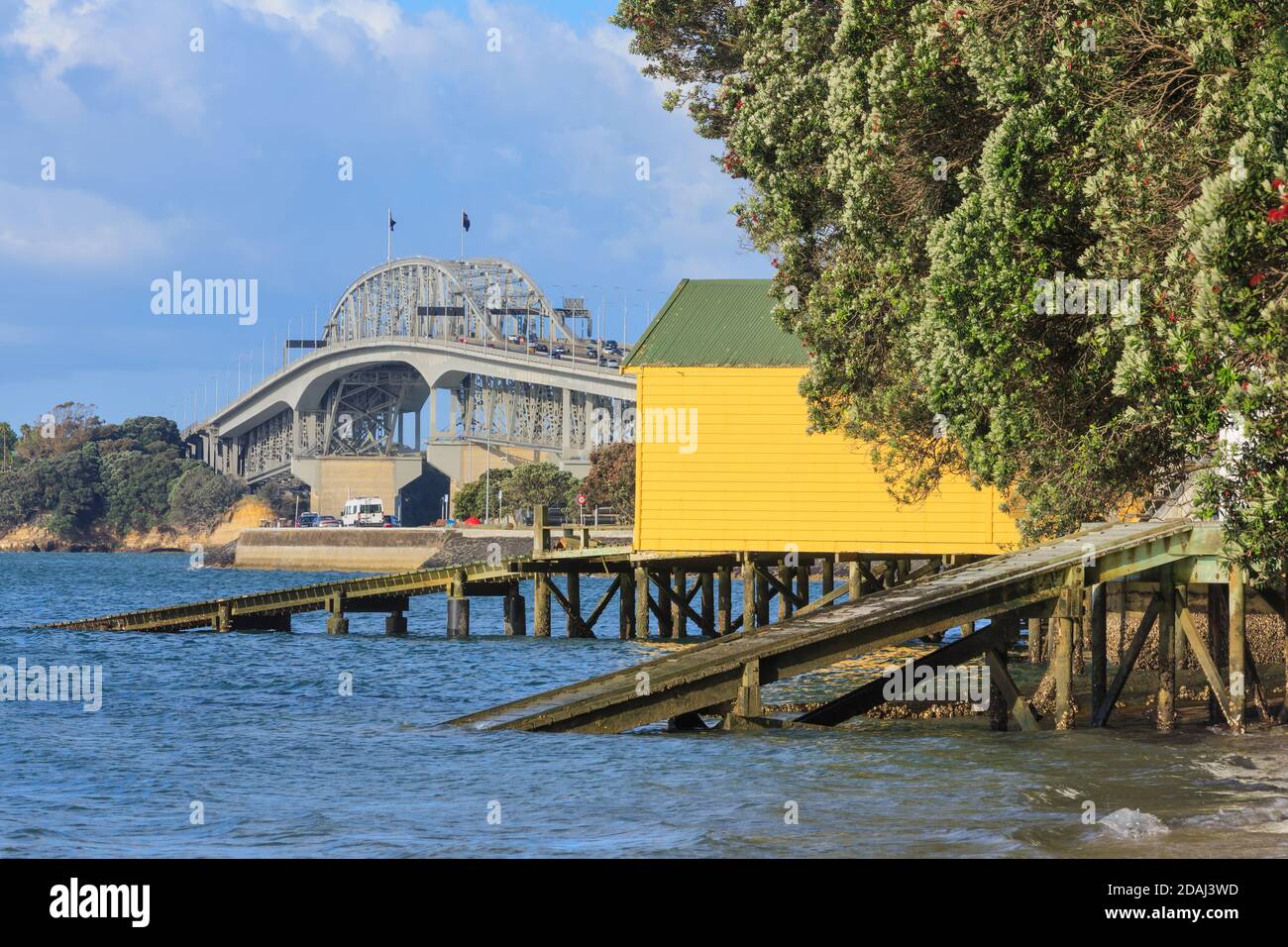 The Auckland Harbour Bridge, Auckland, New Zealand, with boathouses on ...