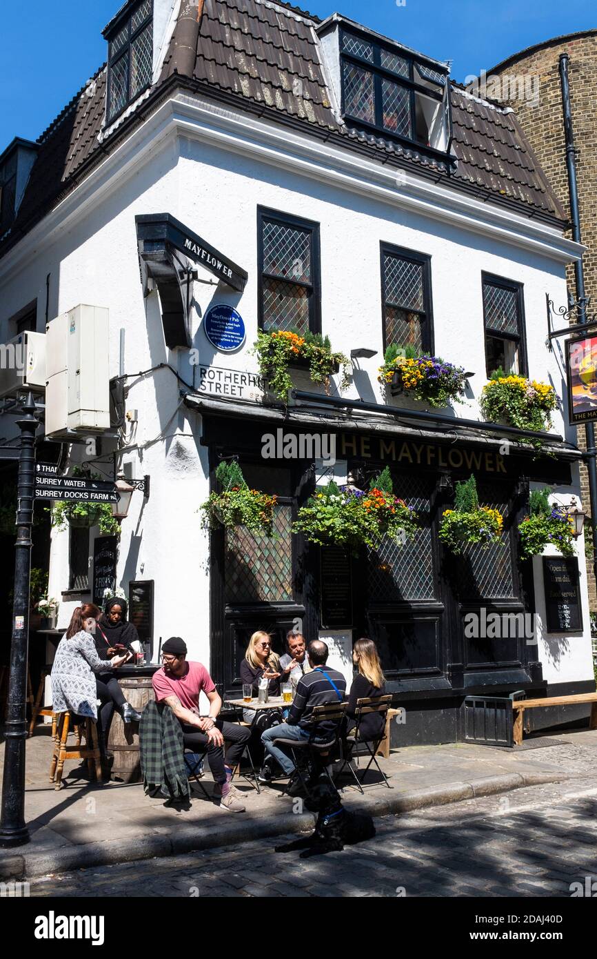 People enjoying a drink outside the historic Mayflower pub in ...