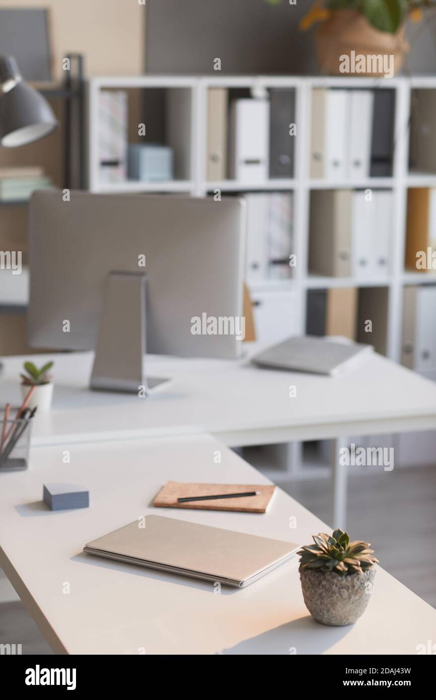 Image of office table with computer monitor and other office supplies ...