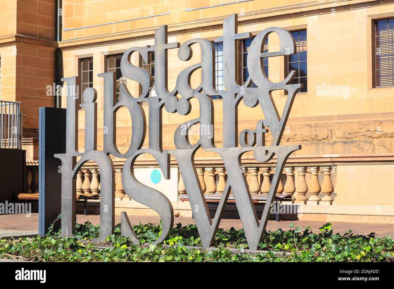 Sculpted metal "State Library of NSW" (New South Wales) outside the ...