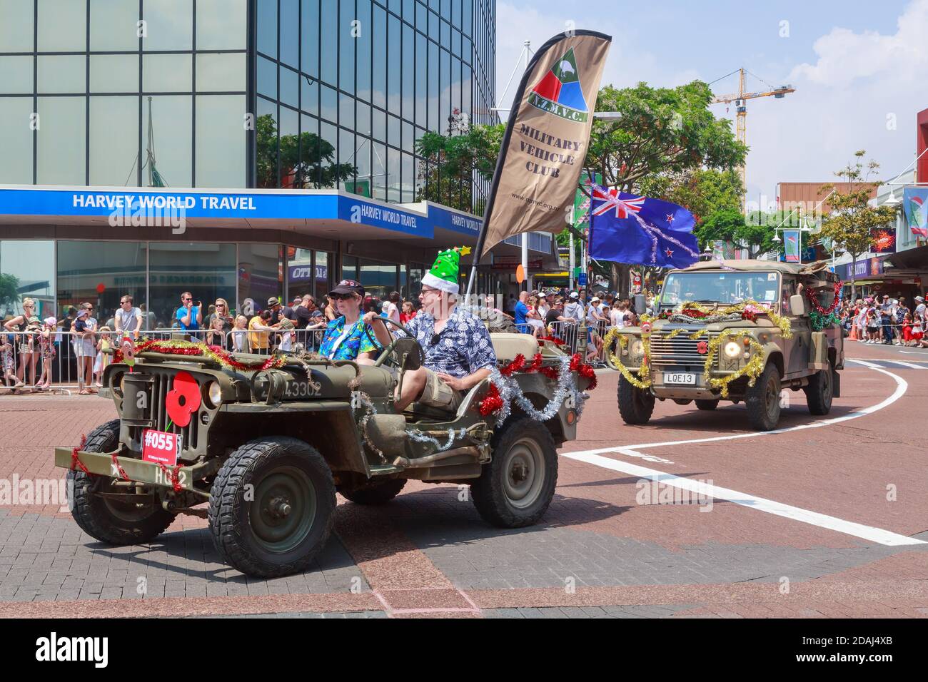 Decorated military vehicles, a jeep and a Land Rover, taking part in a ...