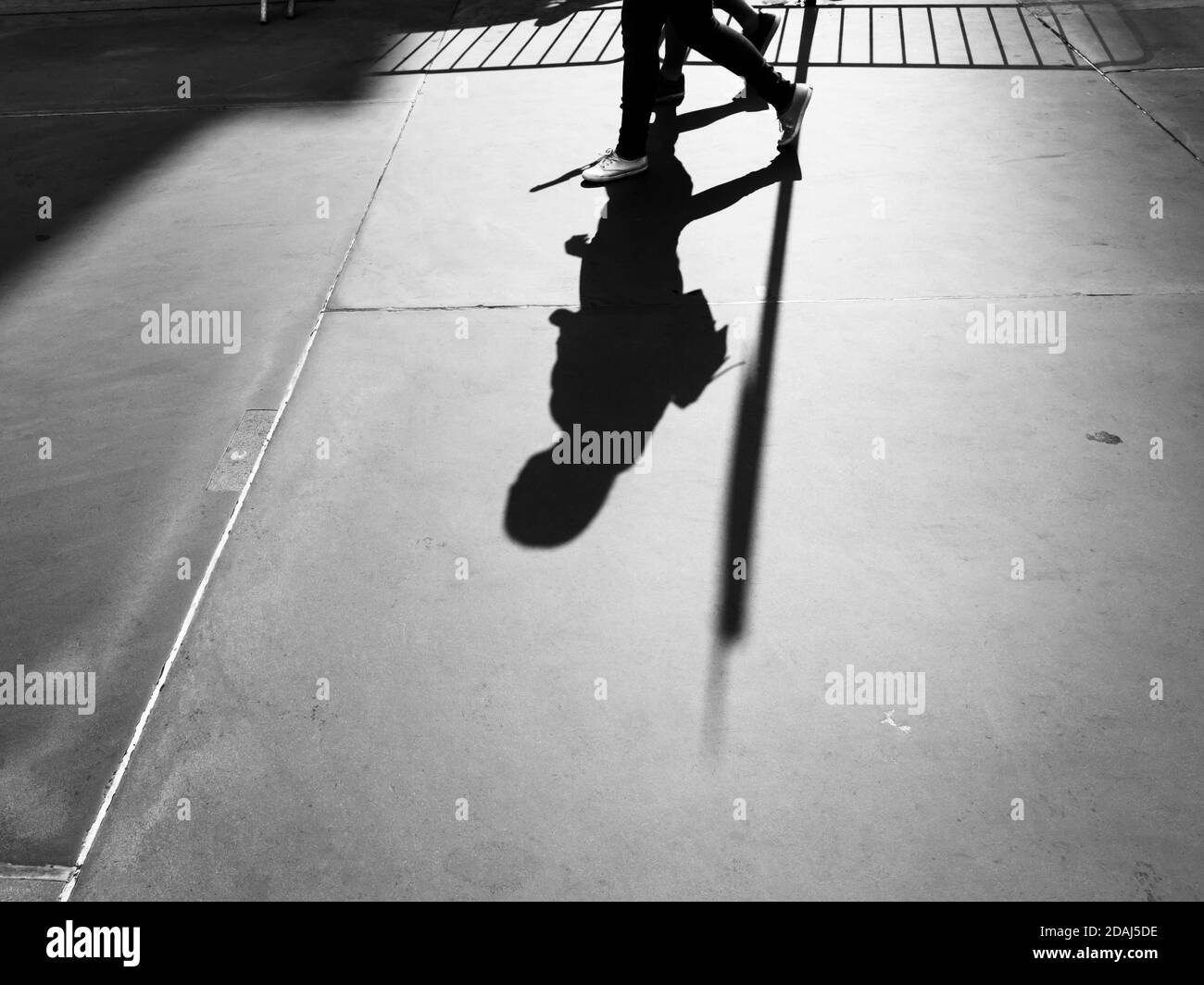 Light and shadows in New York City. Shadows of people walking street in ...