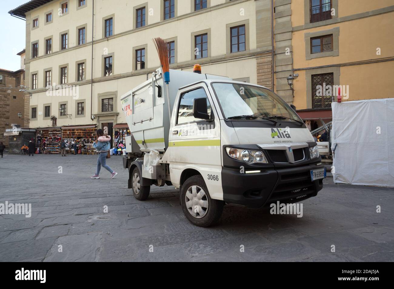 Garbage collection machine stands against the background of ancient ...