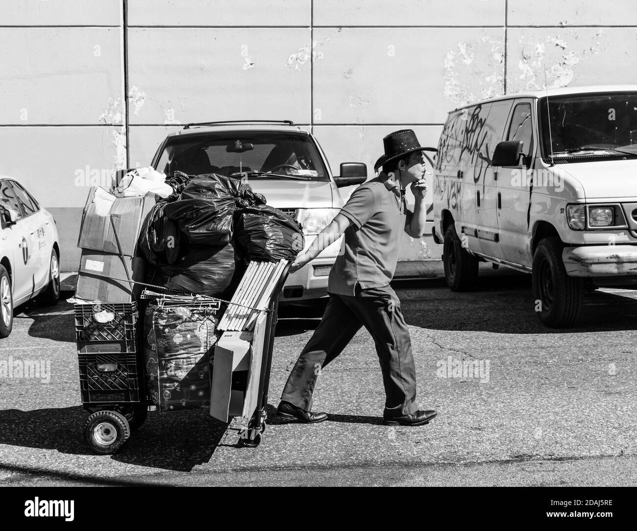Young delivery man walking Black and White Stock Photos & Images - Alamy