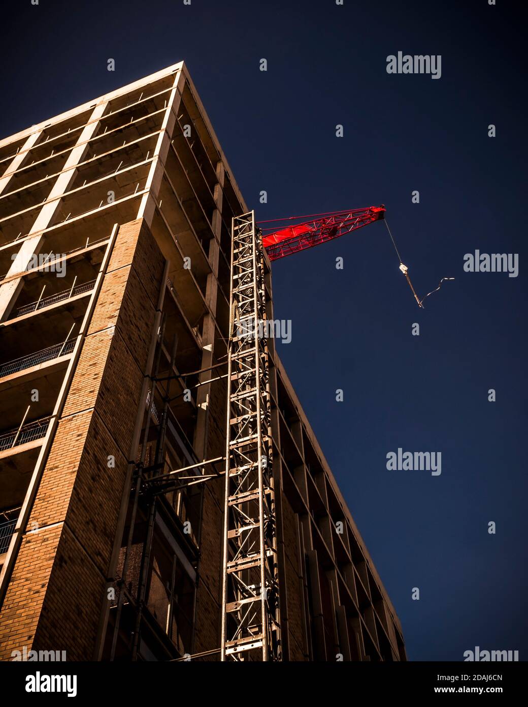A red jib above a construction site Stock Photo - Alamy