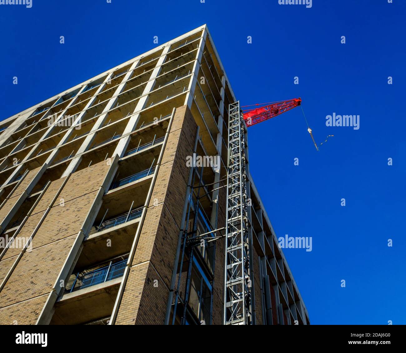 A red jib above a construction site Stock Photo - Alamy