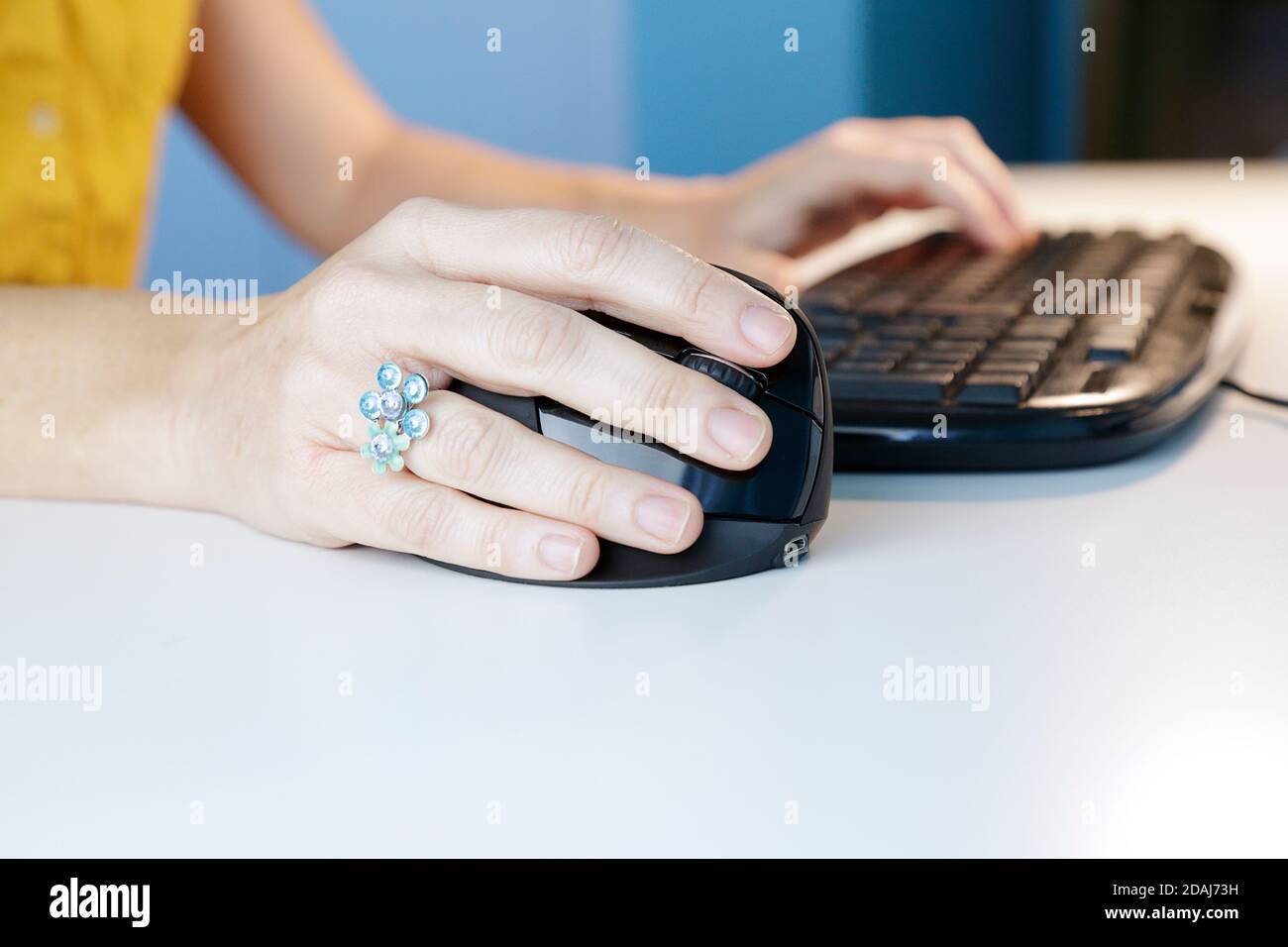 Close up of woman using mouse and computer keyboard working from home ...