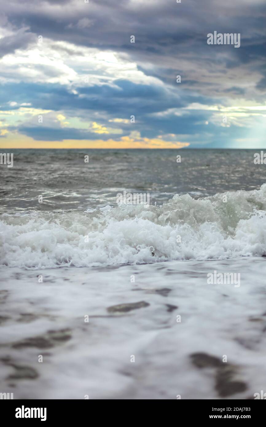 summer Sea or ocean cloudy sky, wave after storm with splash. Space for ...