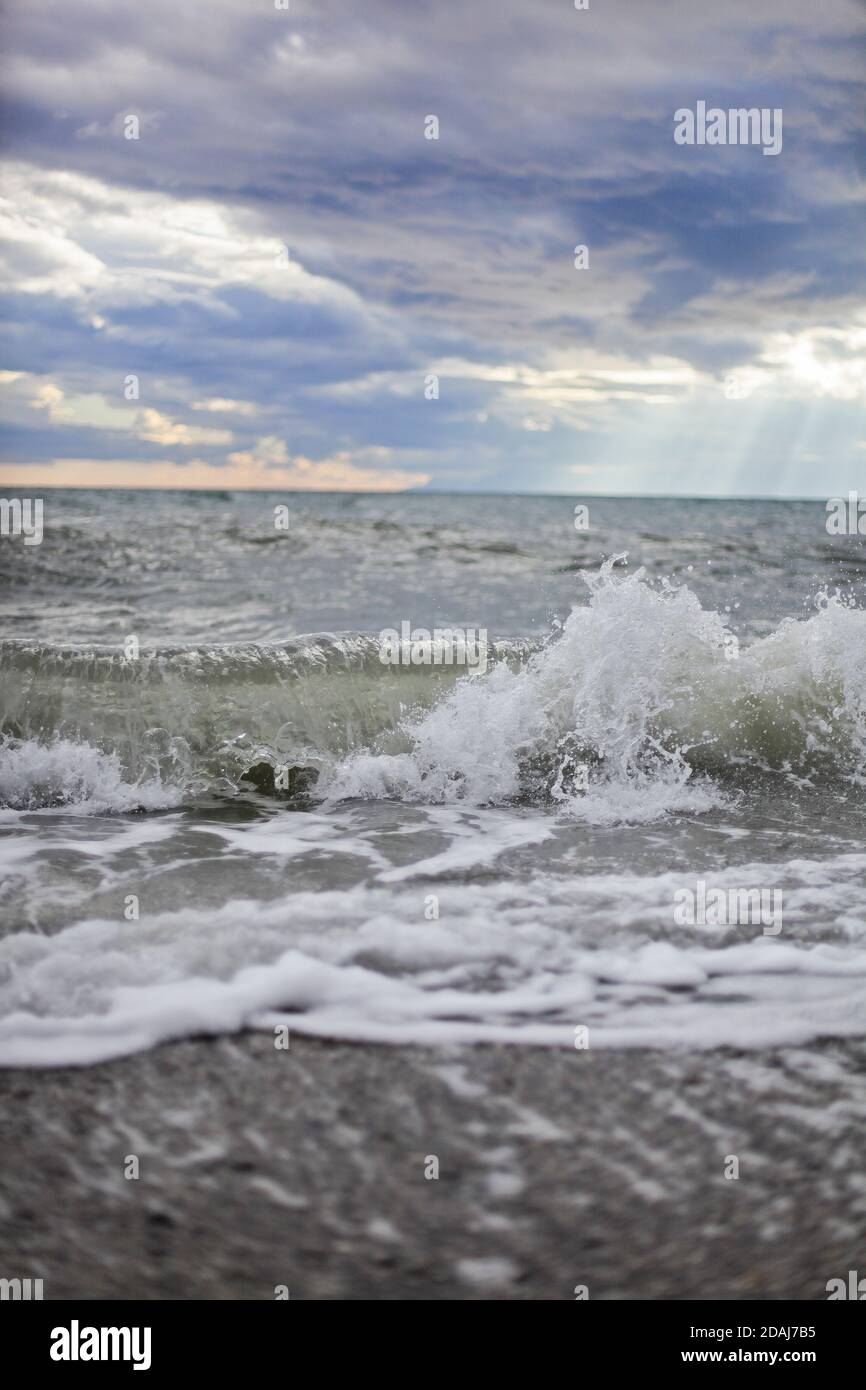 summer Sea or ocean cloudy sky, wave after storm with splash. Space for ...