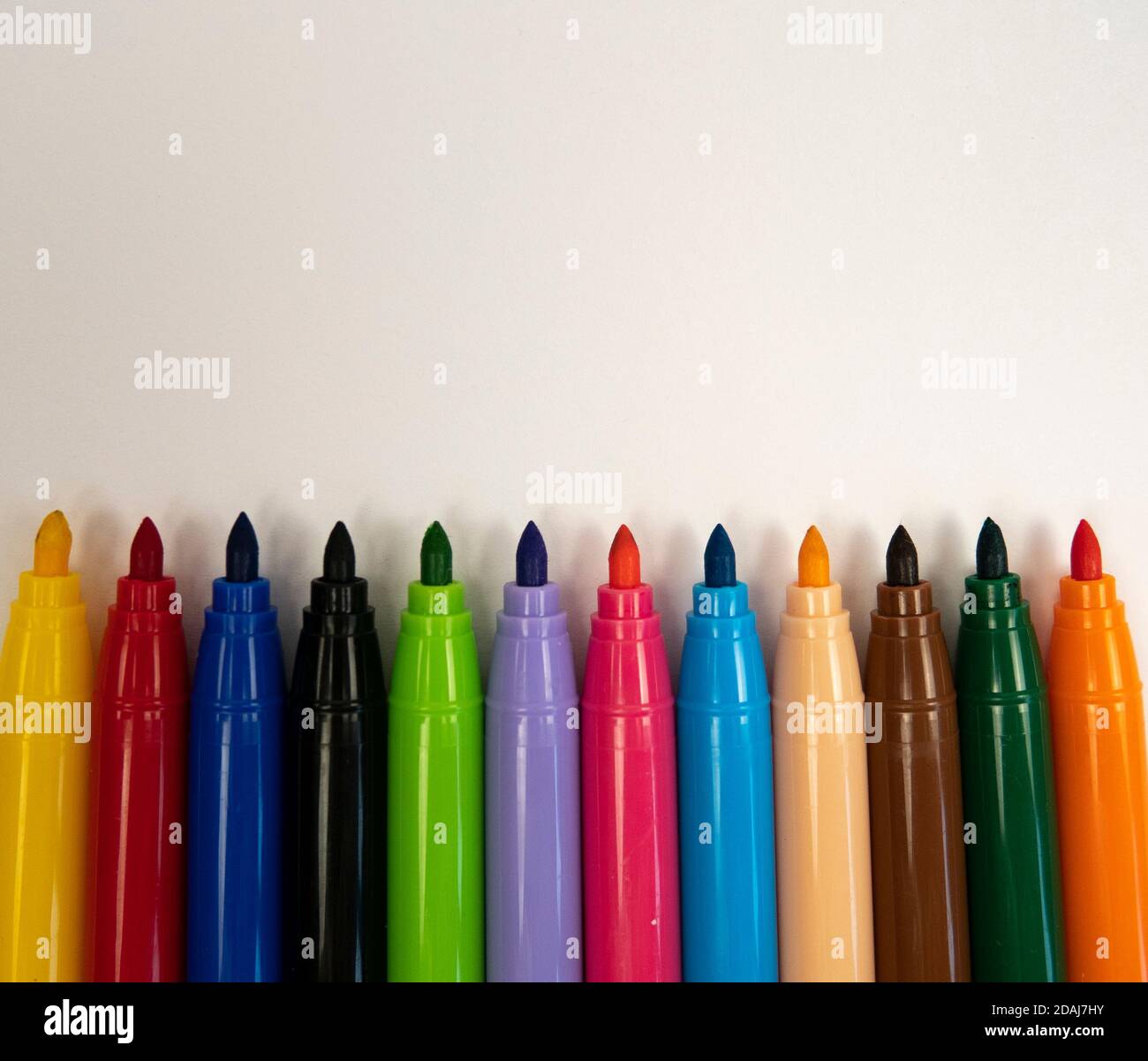 Different colors of felt tip pens on white background. Craft work ...