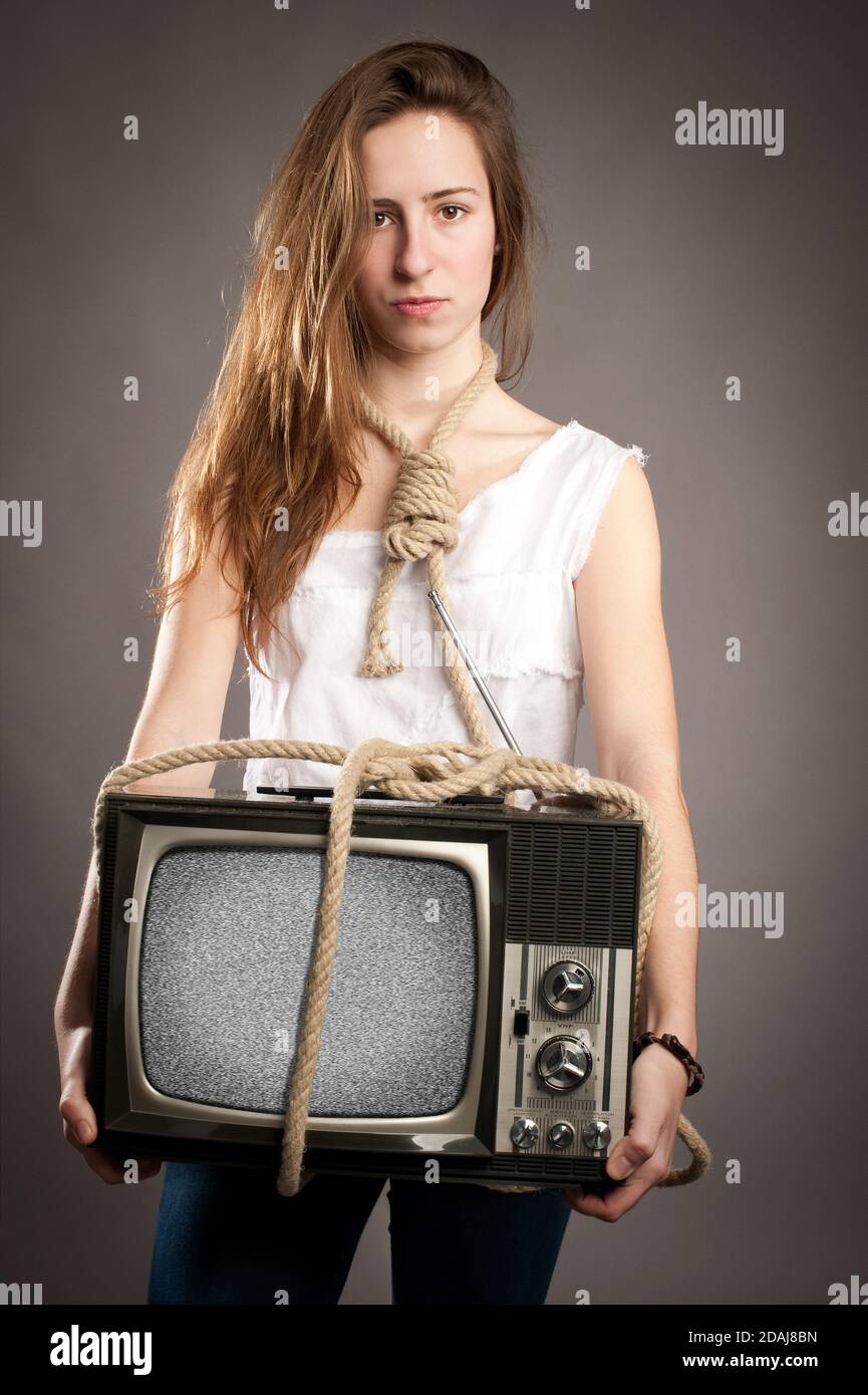young girl with rope holding retro television Stock Photo - Alamy