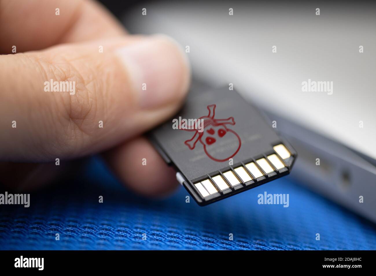 infecting a portable computer with a virus via sd card Stock Photo - Alamy