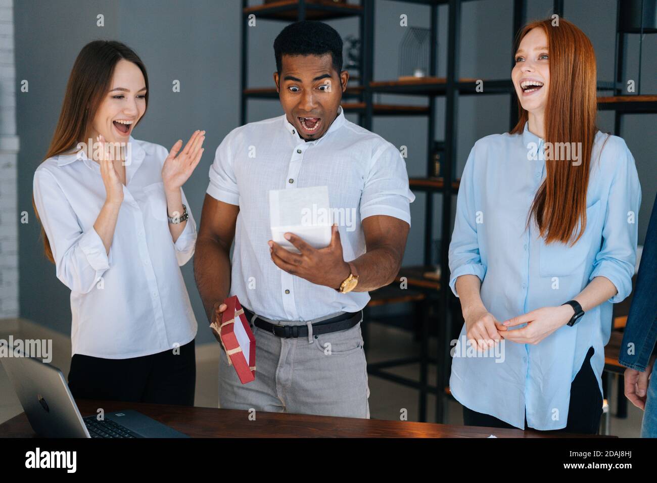 Cheerful diverse team of employees from start-up firm celebrating ...