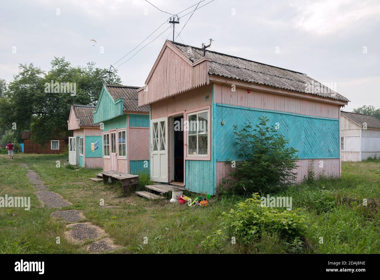 Wooden summer tourist houses at the Iskra camp site in the village of ...