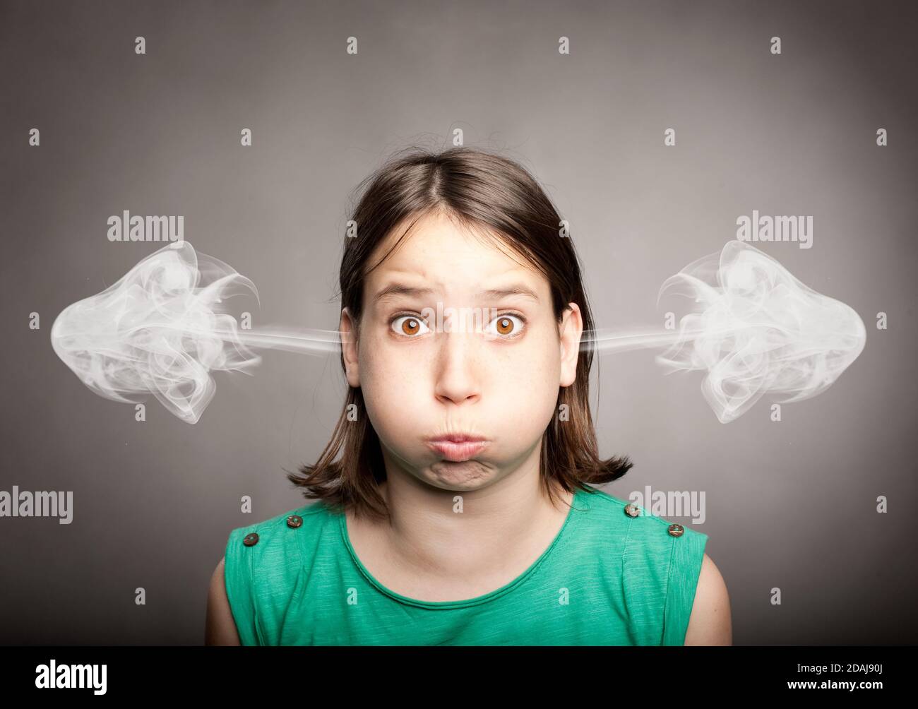 young girl with smoke on her ears Stock Photo - Alamy