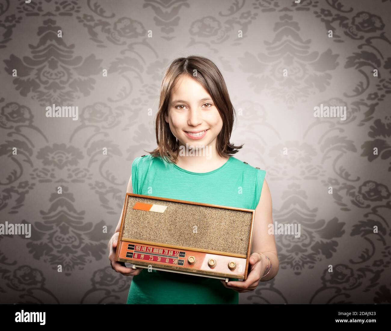 Retro girl holding radio hi-res stock photography and images - Alamy