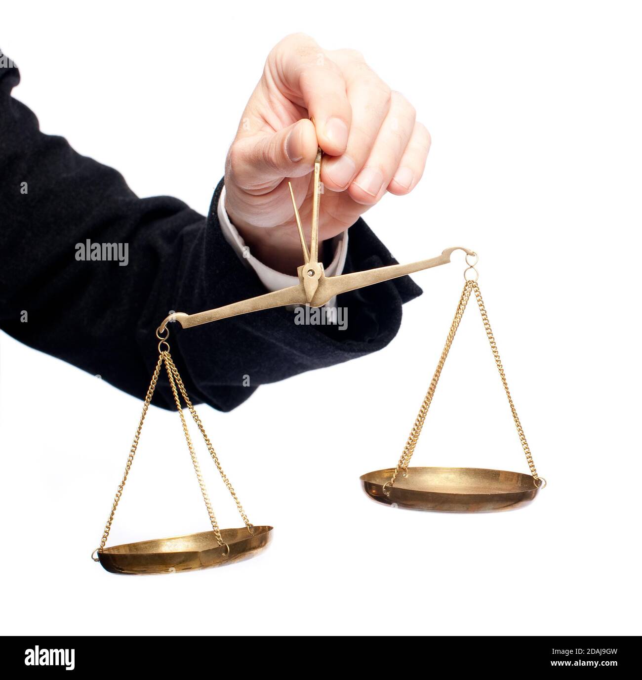 businessman hand holding a balance on white background Stock Photo - Alamy
