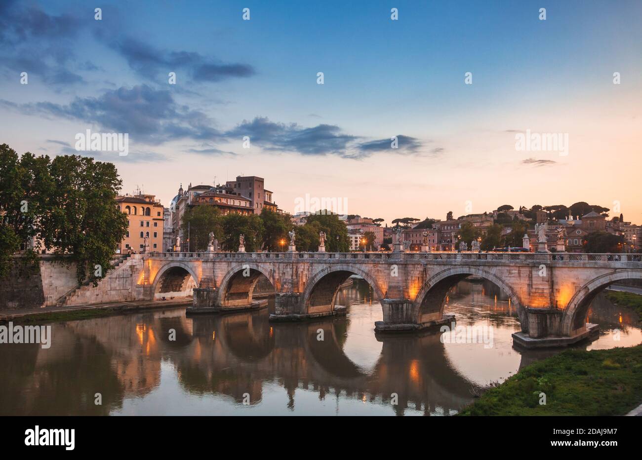 Evening view of Ponte Sant Angelo ancient pedestrian bridge over Tiber river in Rome, Italy ...