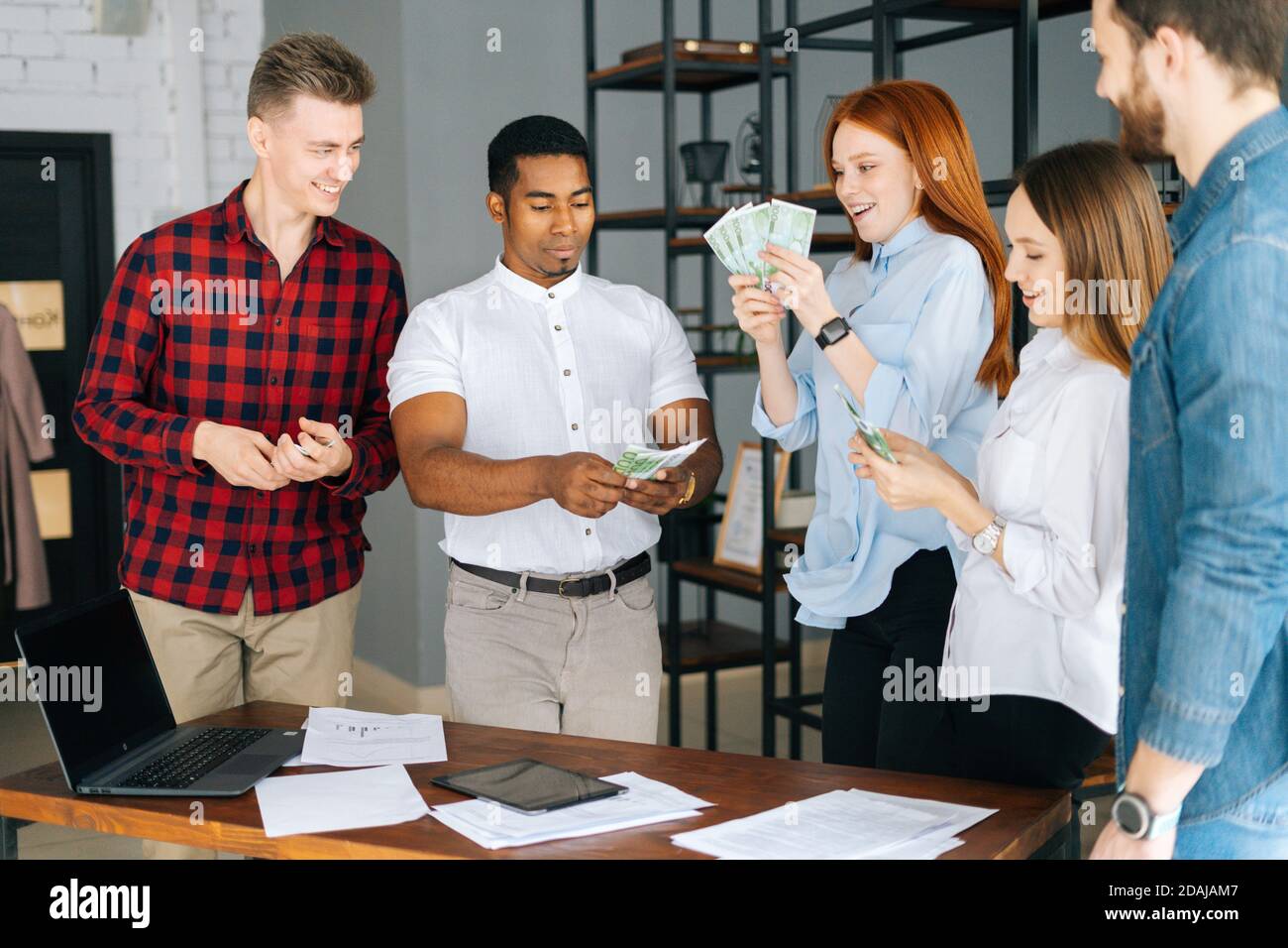 Happy rich man throwing money hi-res stock photography and images - Alamy