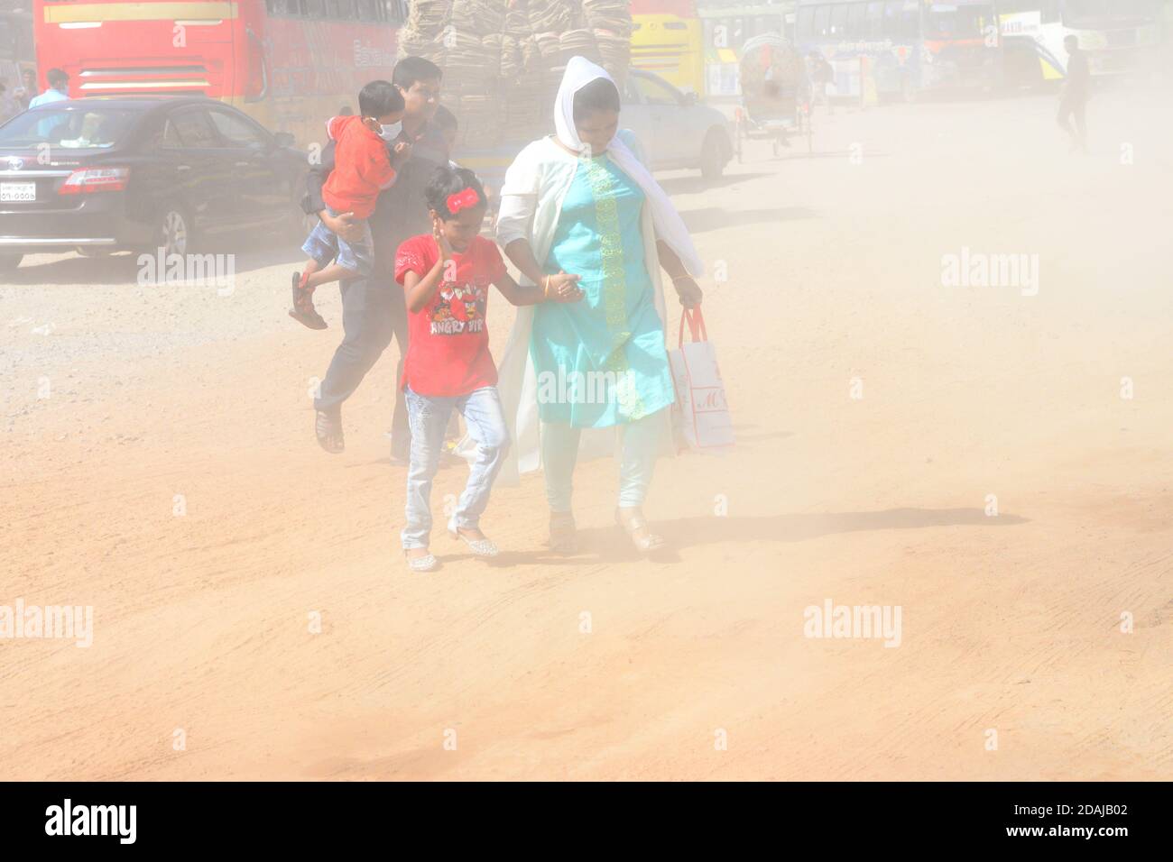 Woman child walking dusty street hi-res stock photography and images ...