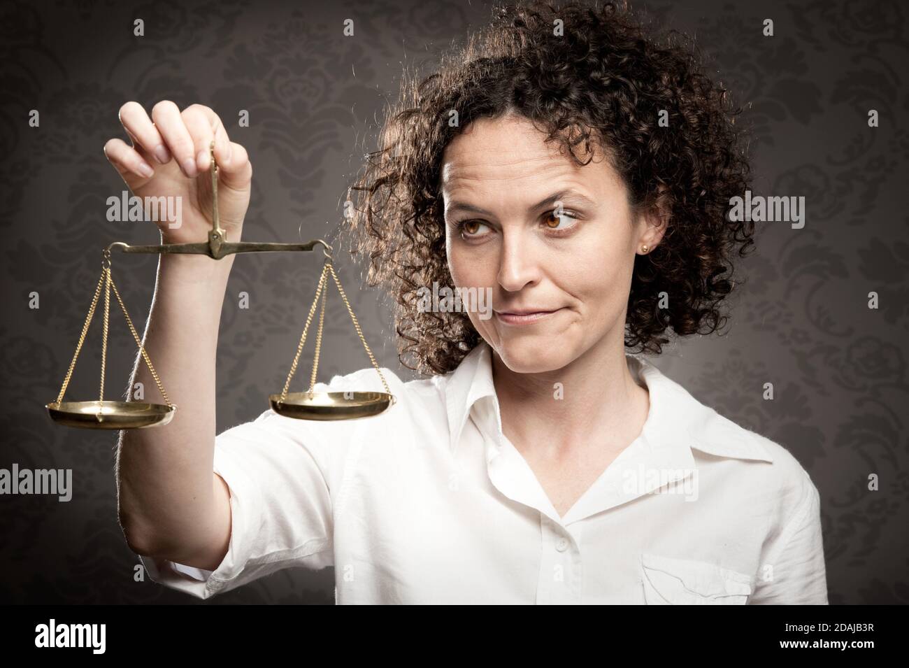 Female hand holding scale justice hi-res stock photography and images - Alamy