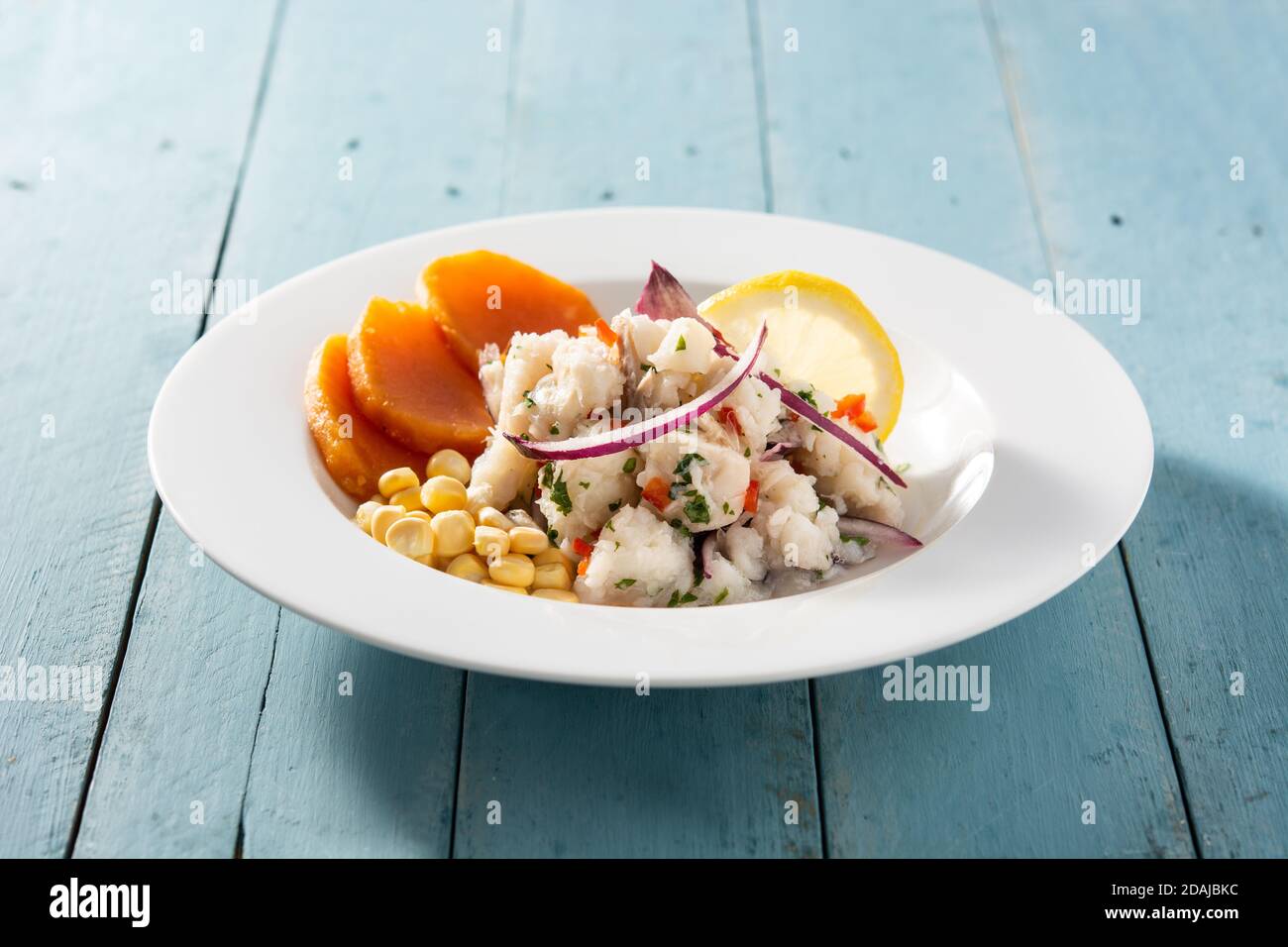 Traditional peruvian ceviche with fish, sweet potato, corn and ...