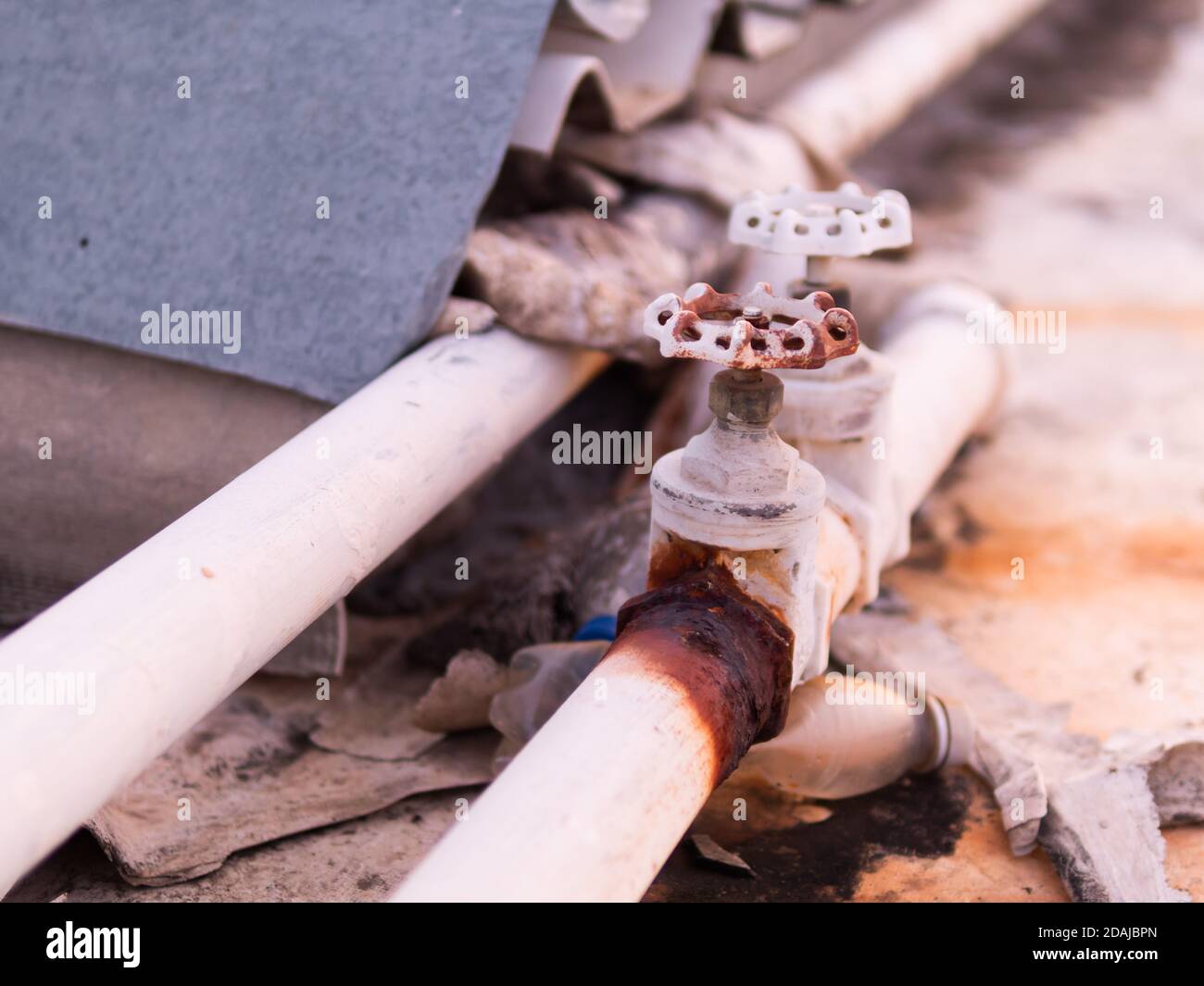 Damaged valves, pipes, and plumbing pipes, and lots of rusting, causing ...